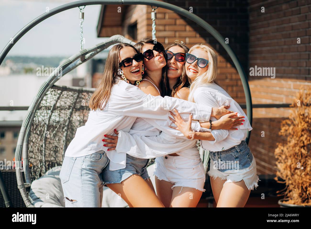 Happy and cheerful group of women friends together dancing and having ...