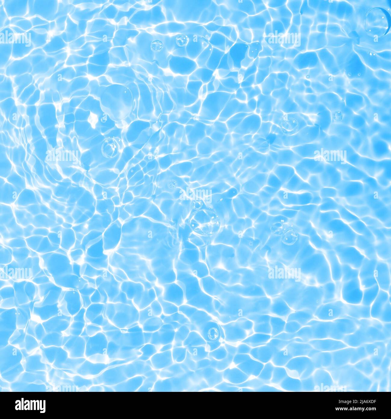 Surface of blue swimming pool water with light reflection. Texture of ...