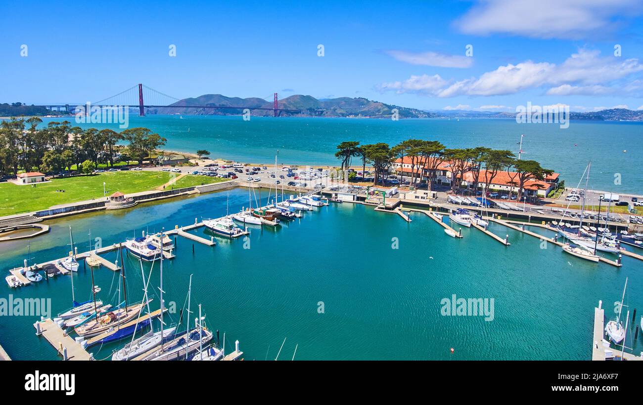 Aerial view of yacht harbor in San Francisco with Golden Gate Bridge in ...