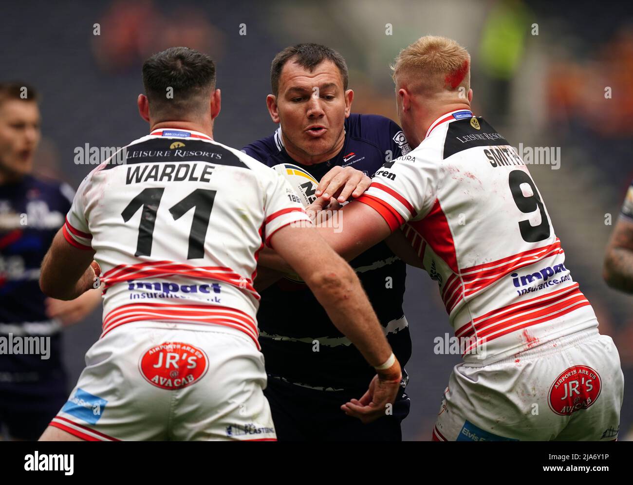 Featherstone Rovers' Brett Ferres (centre) tackled by Leigh Centurions ...