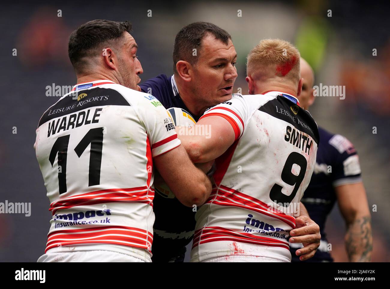 Featherstone Rovers' Brett Ferres (centre) tackled by Leigh Centurions ...