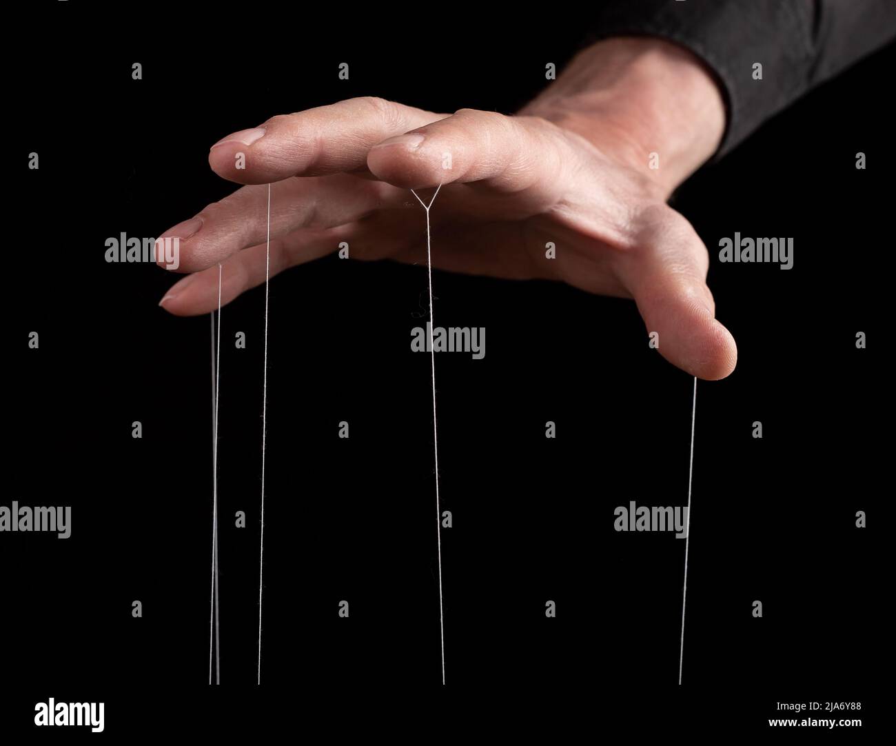 Authority, domination concept. Man hand with strings on fingers. Master ...
