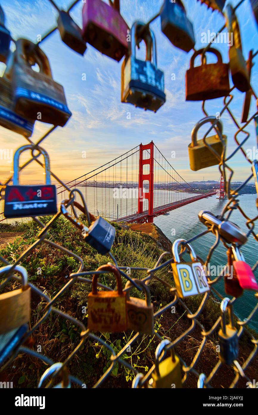 Golden Gate Bridge in California through hole in chain link fence ...