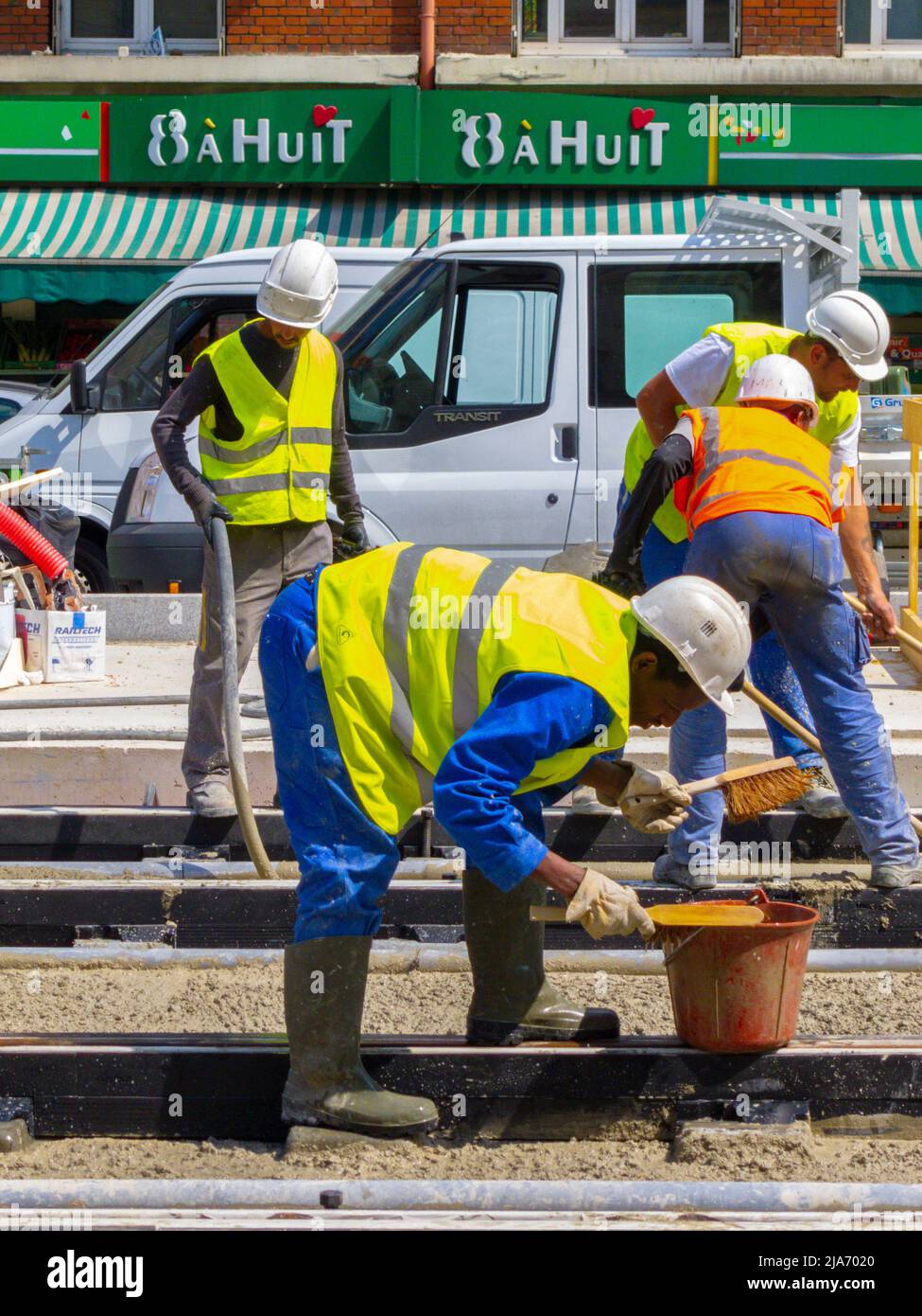 Paris, France, Group Foreign Construction Workers Applying Concrete to ...