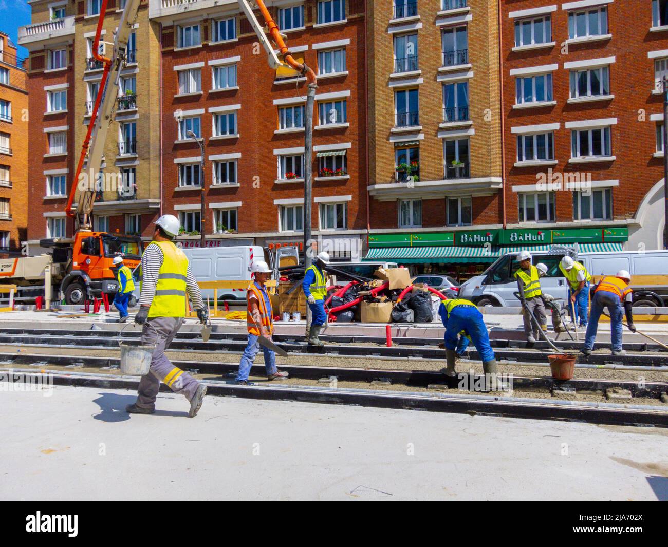 Paris, France, Group Foreign Construction Workers Applying Concrete to ...