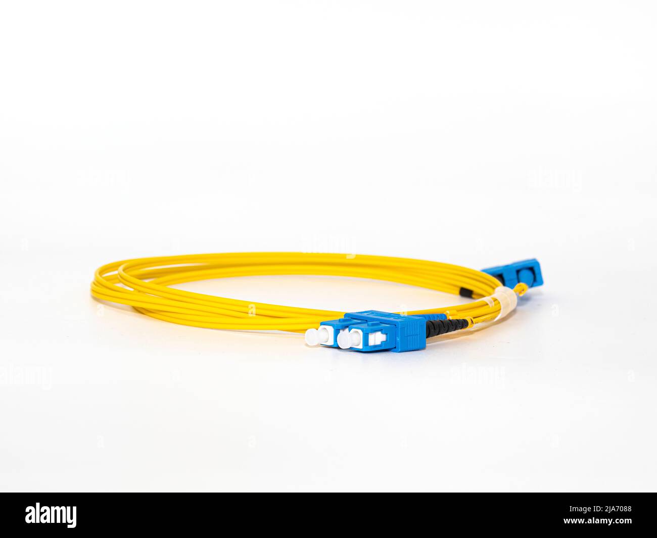 Fiber Optic Patch Cord on isolated white background Stock Photo - Alamy