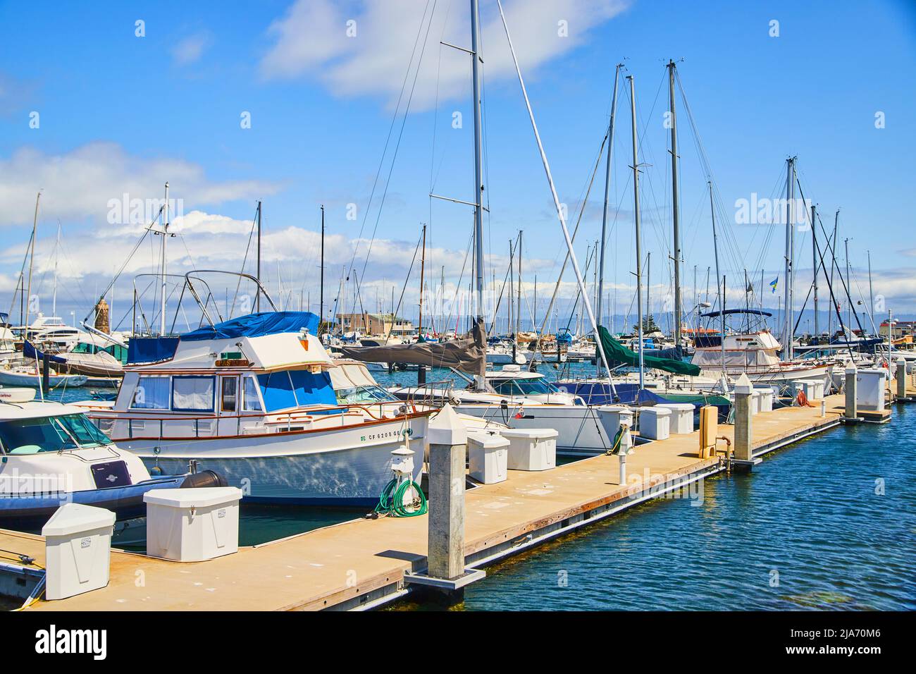 Harbor by ocean filled with small ships Stock Photo - Alamy
