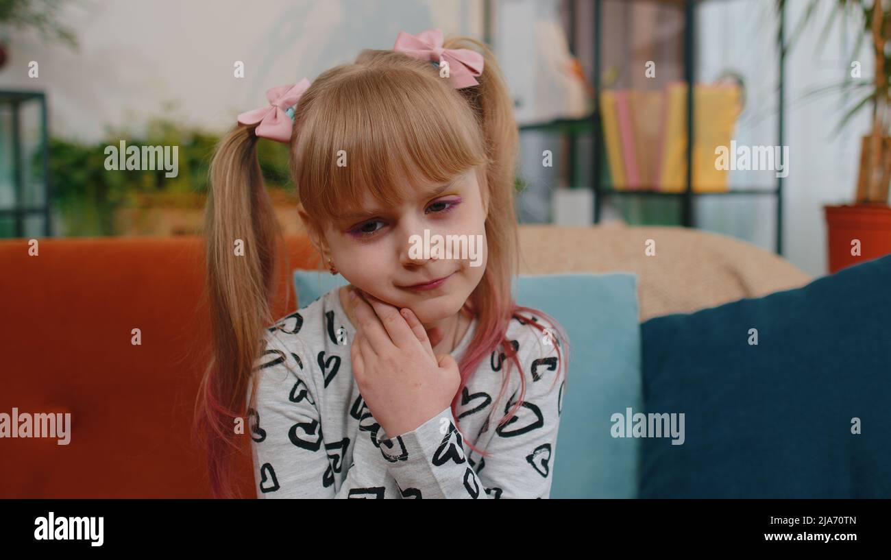 Toddler kid girl touching cheek, terrible suffer from painful toothache ...