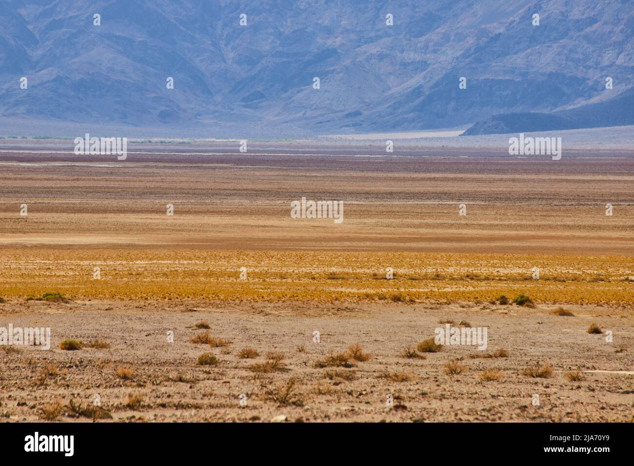 Death Valley desert layers of fall colors in plains and mountains in ...