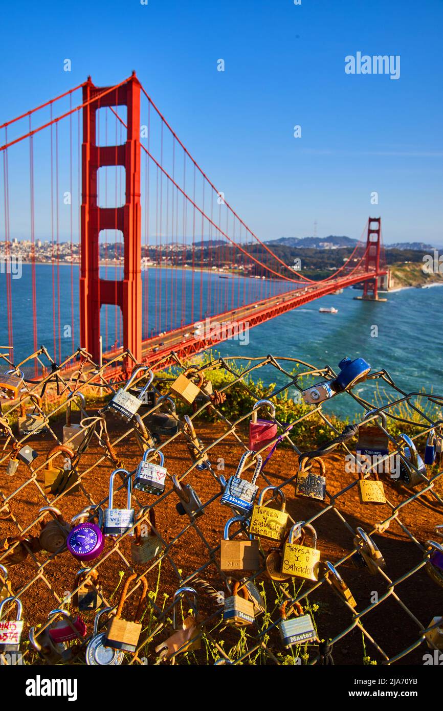 Golden Gate Bridge next to chain linked fence covered in locks Stock ...