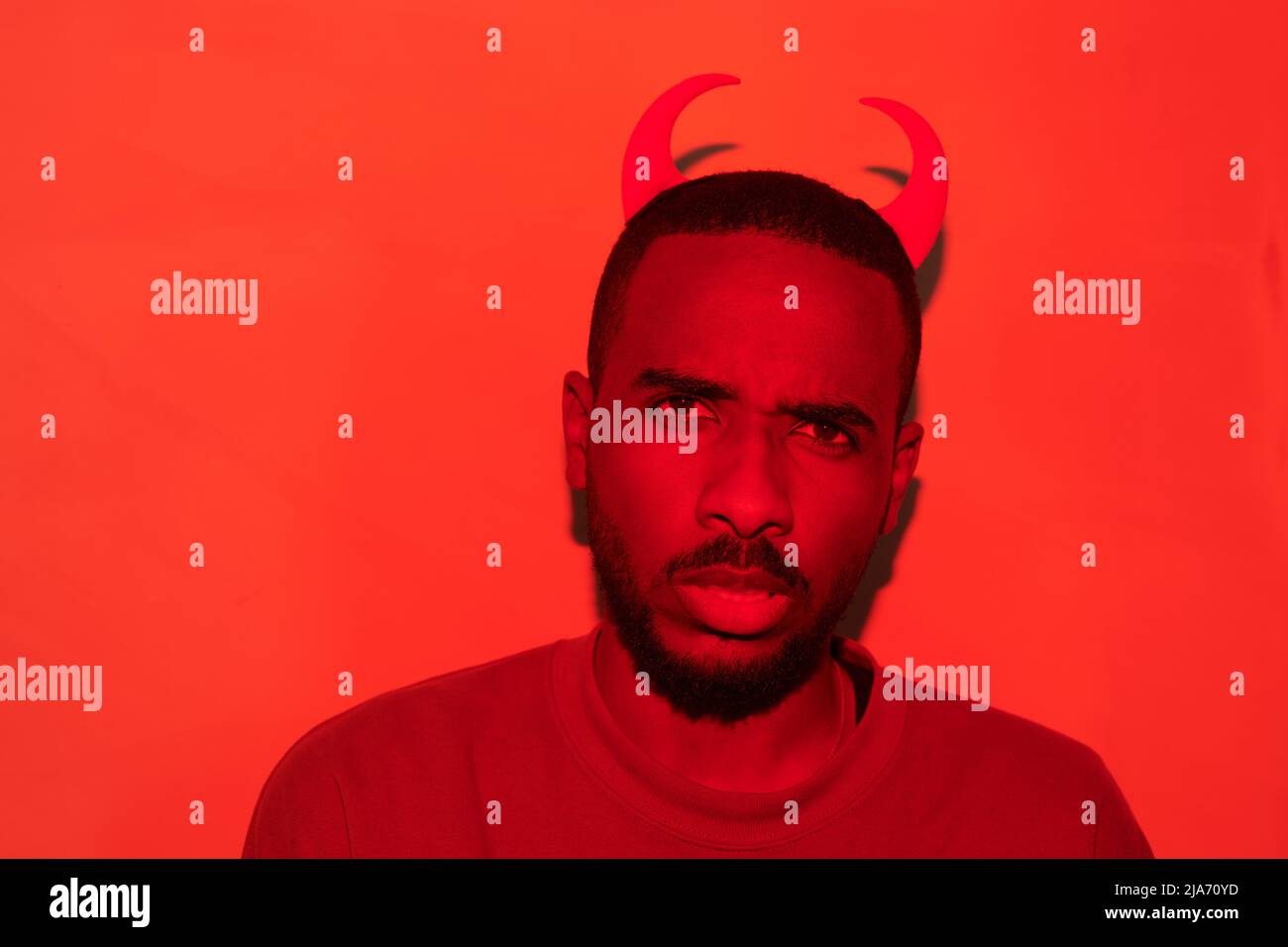 Man with devil horns hi-res stock photography and images - Alamy