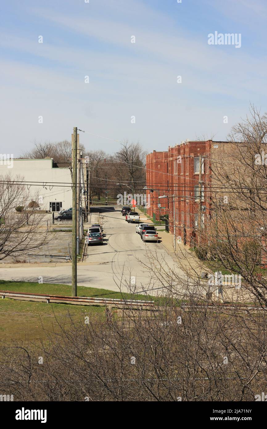 Standard typical inner city neighborhood with cars, apartment buildings ...