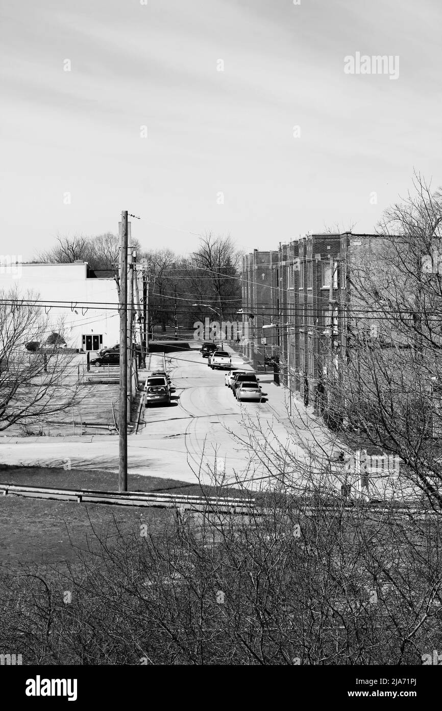 Standard typical inner city neighborhood with cars, apartment buildings ...