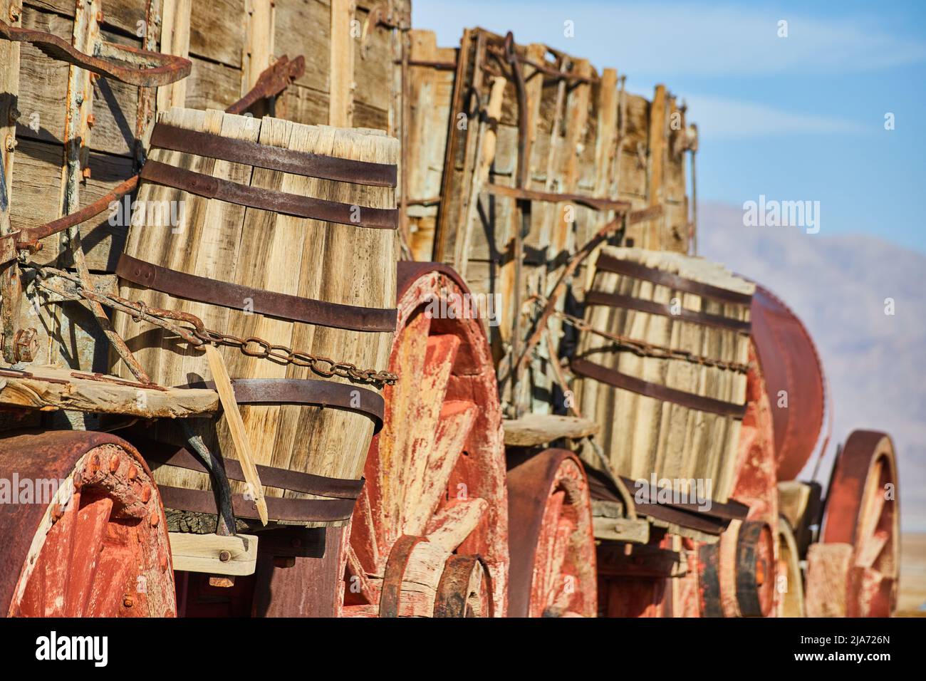 Detail of old train cart with wheels and barrels Stock Photo - Alamy
