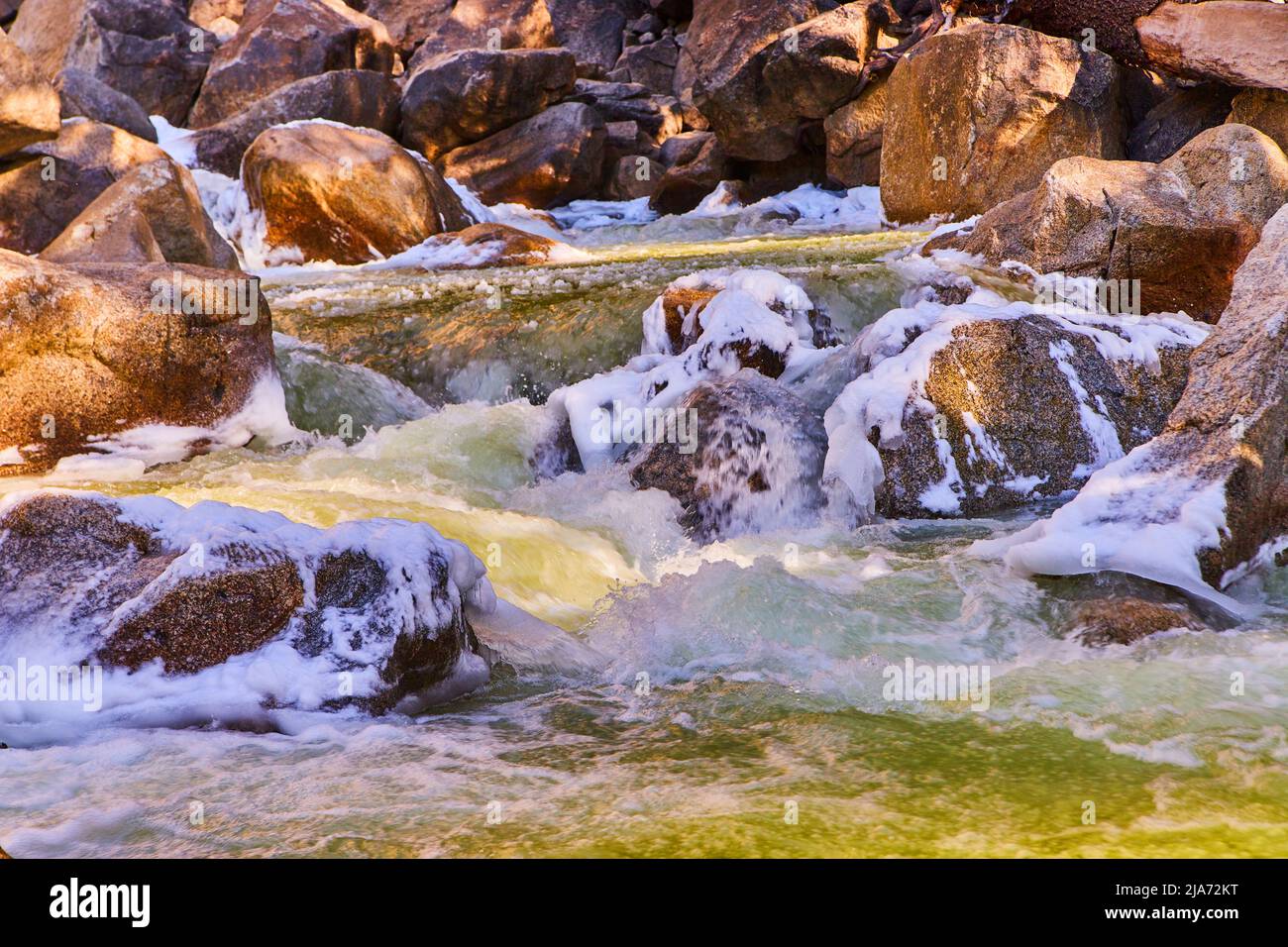 Fast and dangerous cascading river over frosty rocks Stock Photo - Alamy