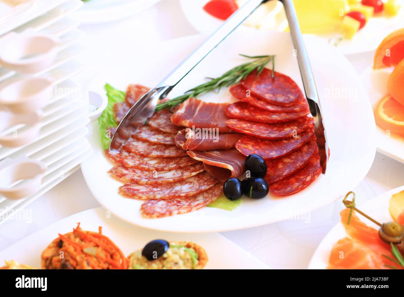 catering table set service with silverware and glass stemware at ...