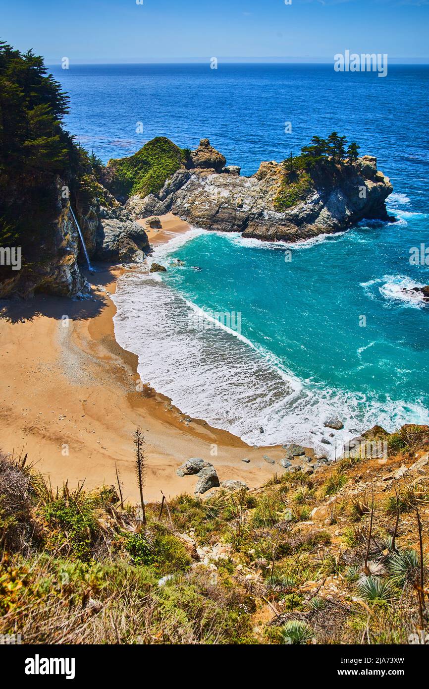 Beach cove with waterfall in California Stock Photo - Alamy