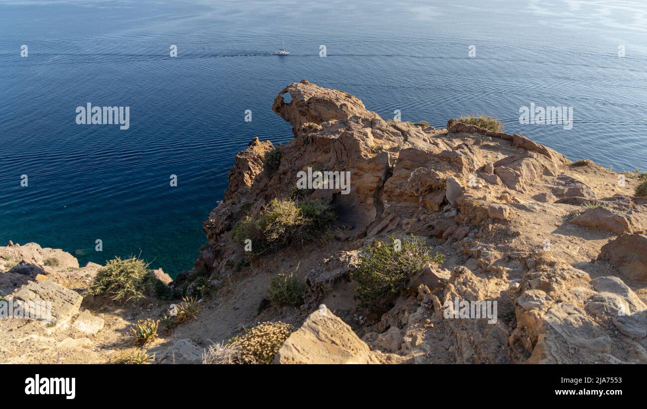 Santorini: A rocky promontory on the coast looks like a dragon's head ...