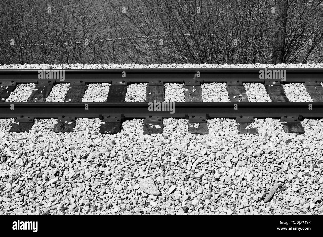 Typical common railroad tracks crossing the plains on a bright sunny ...