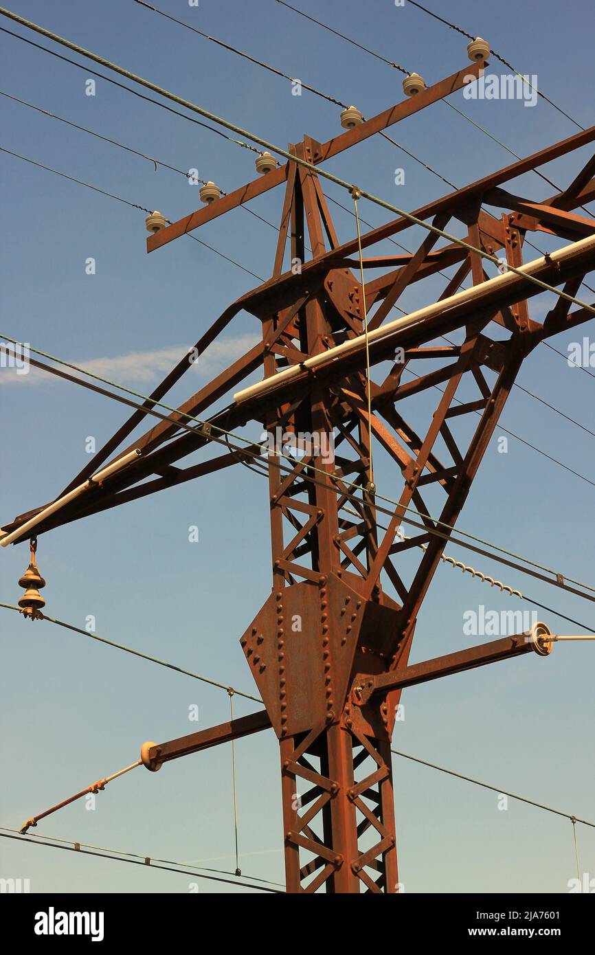 Power tower and lines marching along the typical railroad tracks Stock ...