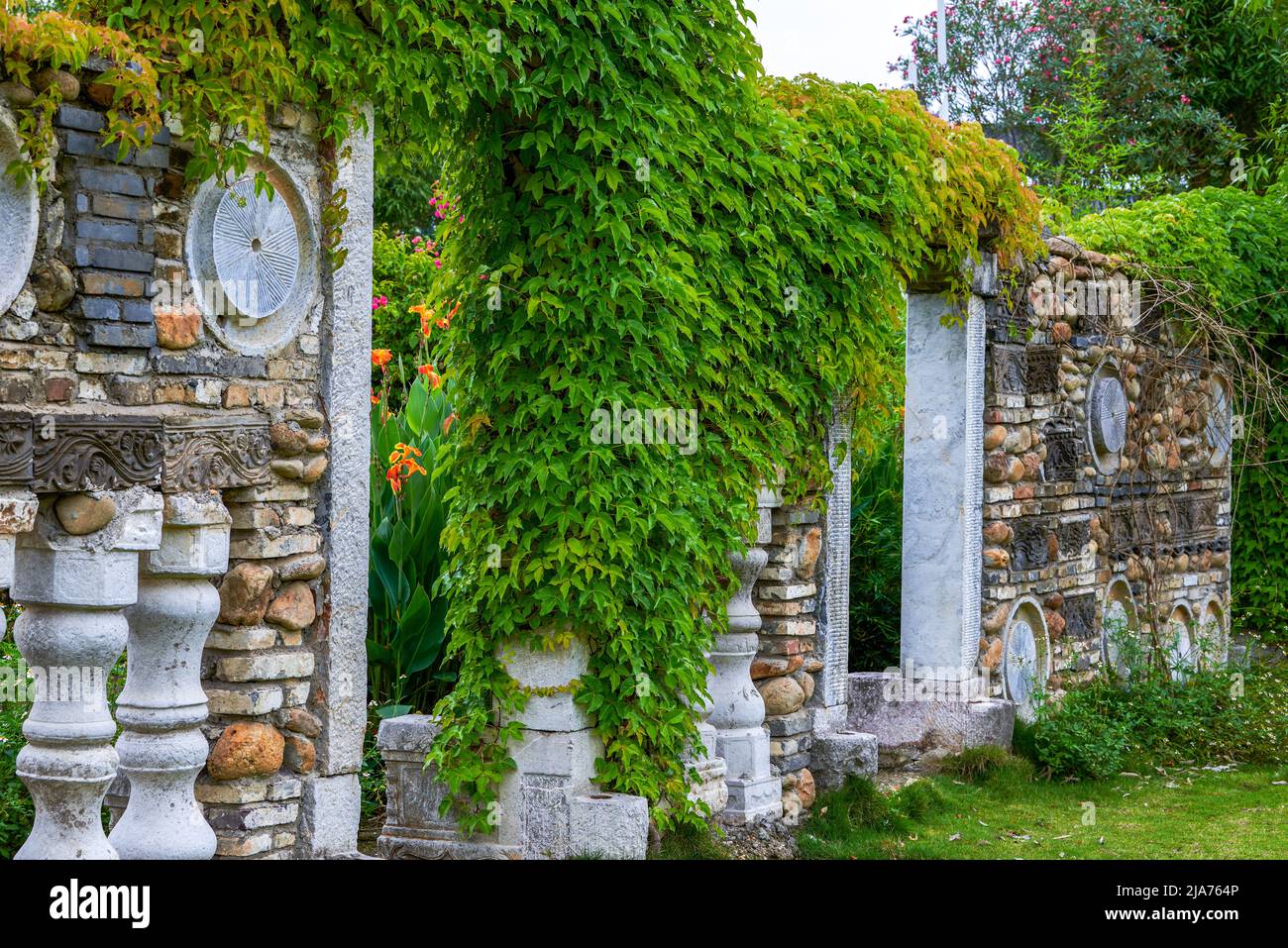 Landscape decorated with traditional stone mill in Chinese garden Stock ...