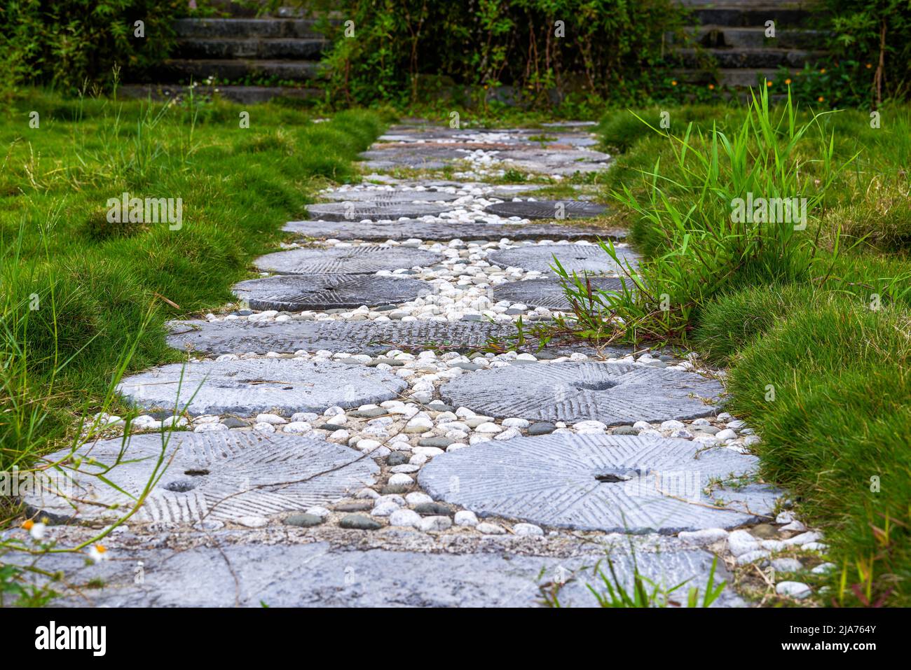 Landscape decorated with traditional stone mill in Chinese garden Stock ...