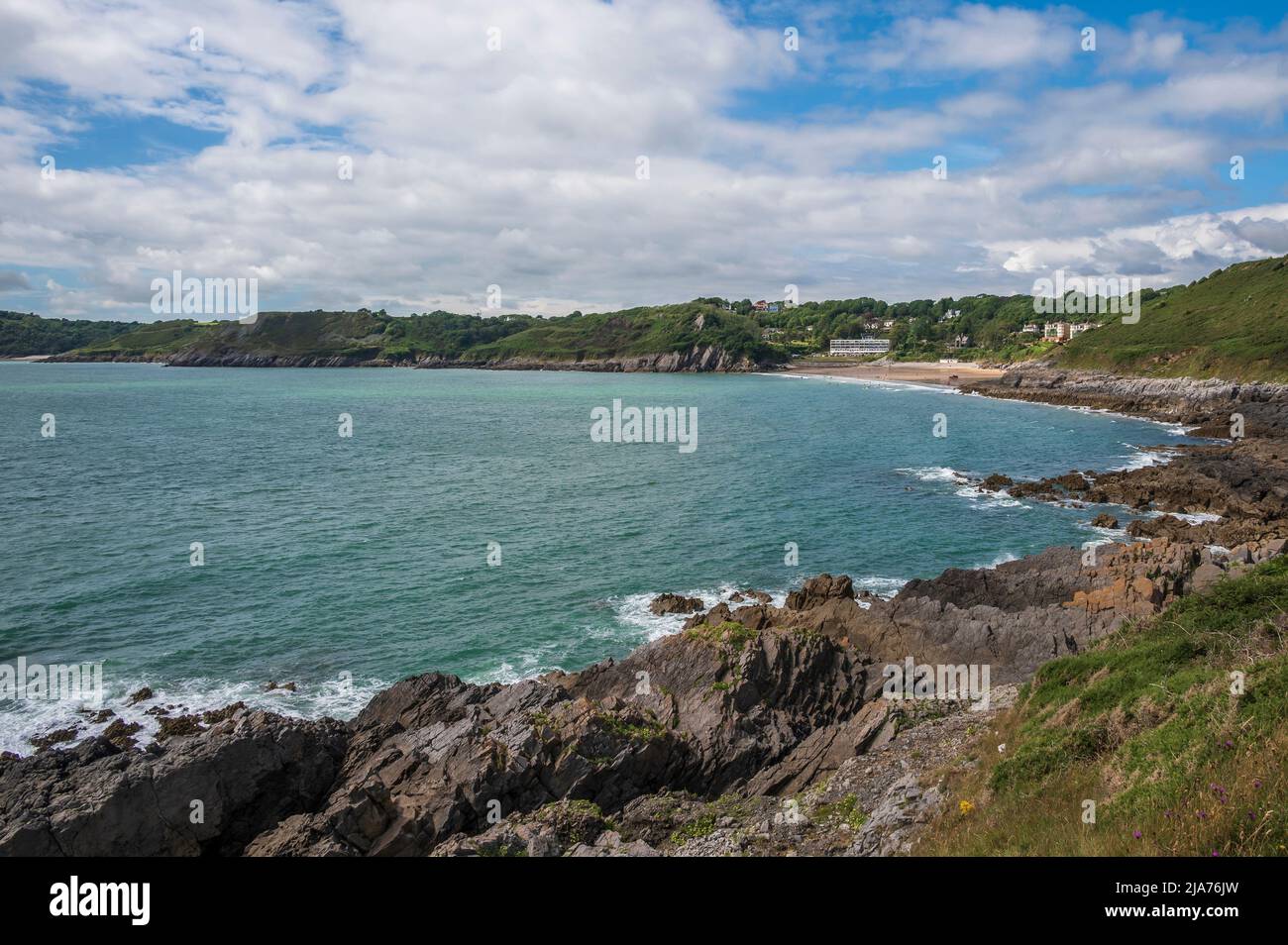 View of the path on the Wales Coastal Path, in Swansea, with a beach in ...