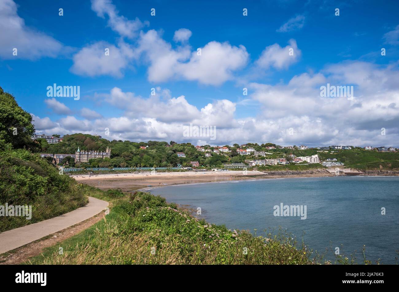 View of the path on the Wales Coastal Path, in Swansea, with a beach in ...
