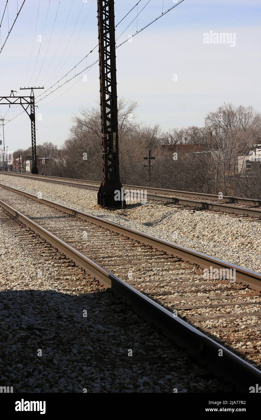 Typical common railroad tracks crossing the plains on a bright sunny ...