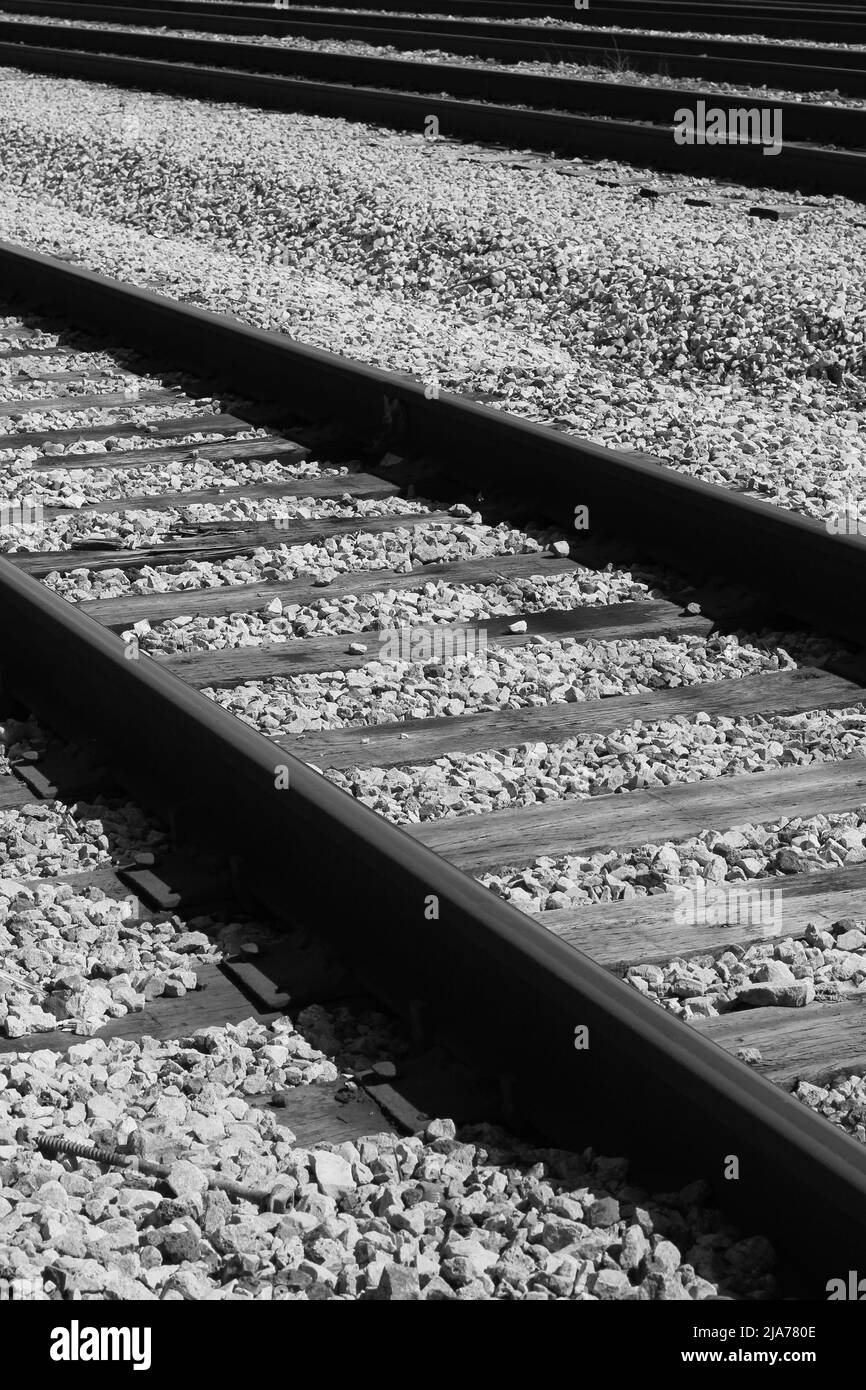 Typical common railroad tracks crossing the plains on a bright sunny ...