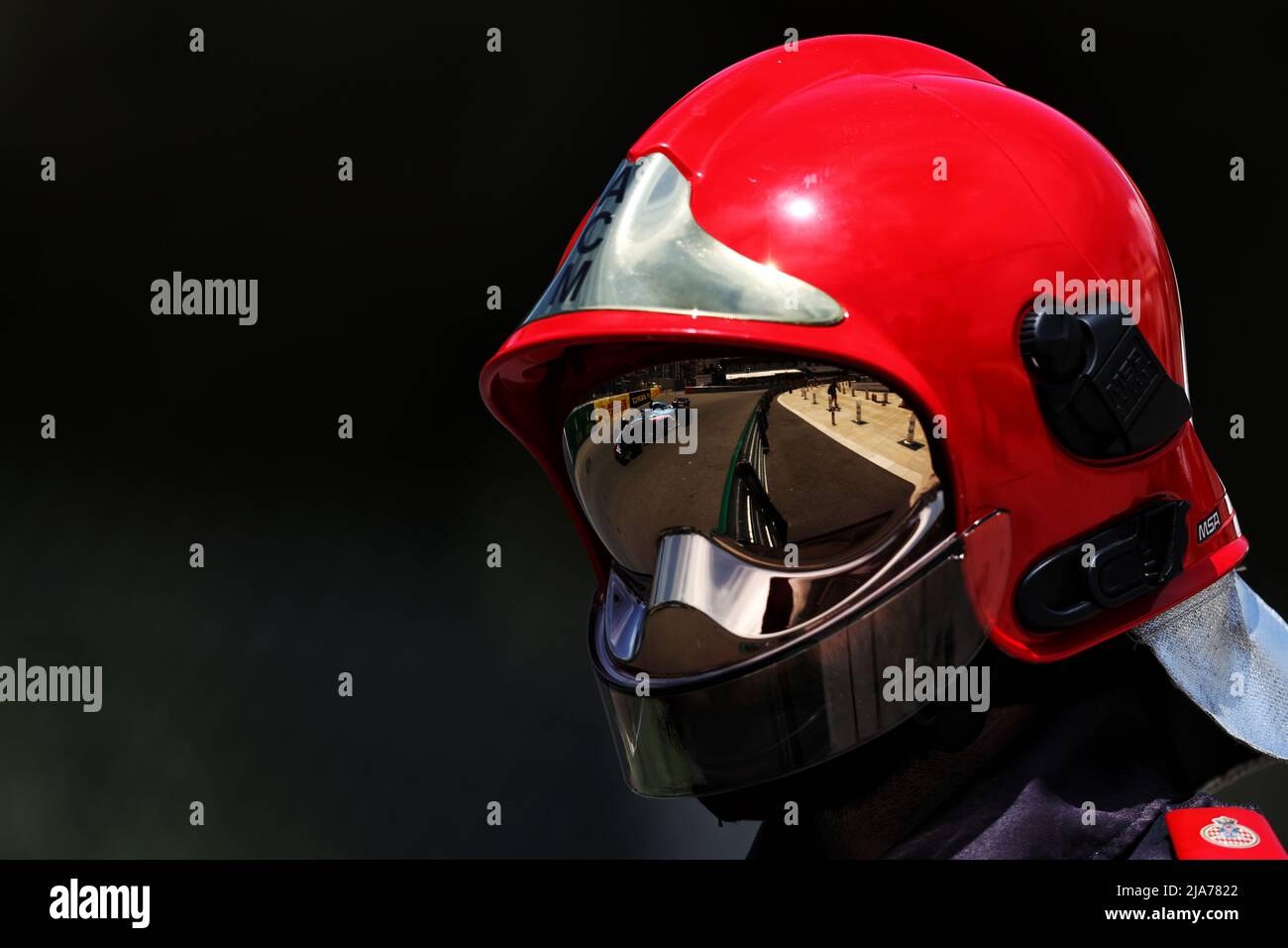 Fernando Alonso (ESP) Alpine F1 Team A522 reflected in a fire marshal's ...