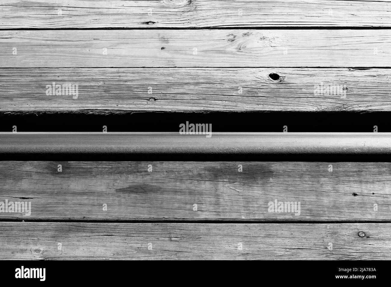 Minimal view of a single railroad track on the wooden train platform in ...