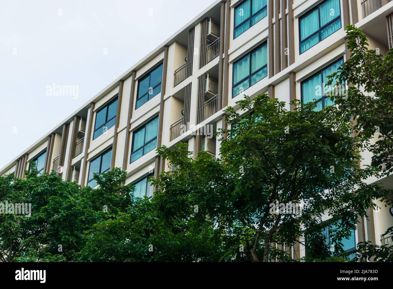 Modern real estate condominium building with blue window, Flat and ...