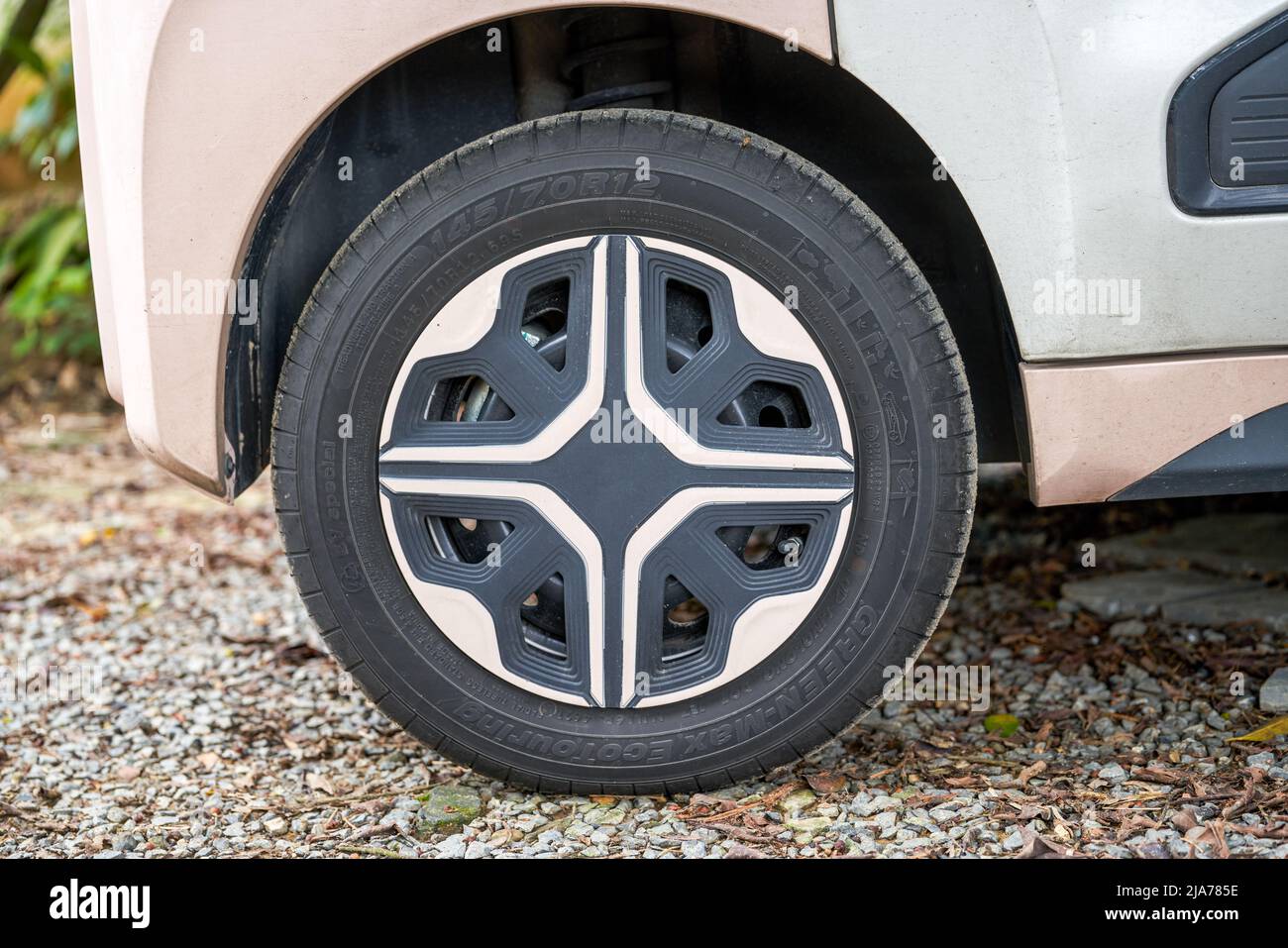 Close-up of the wheels of a small electric car Stock Photo - Alamy