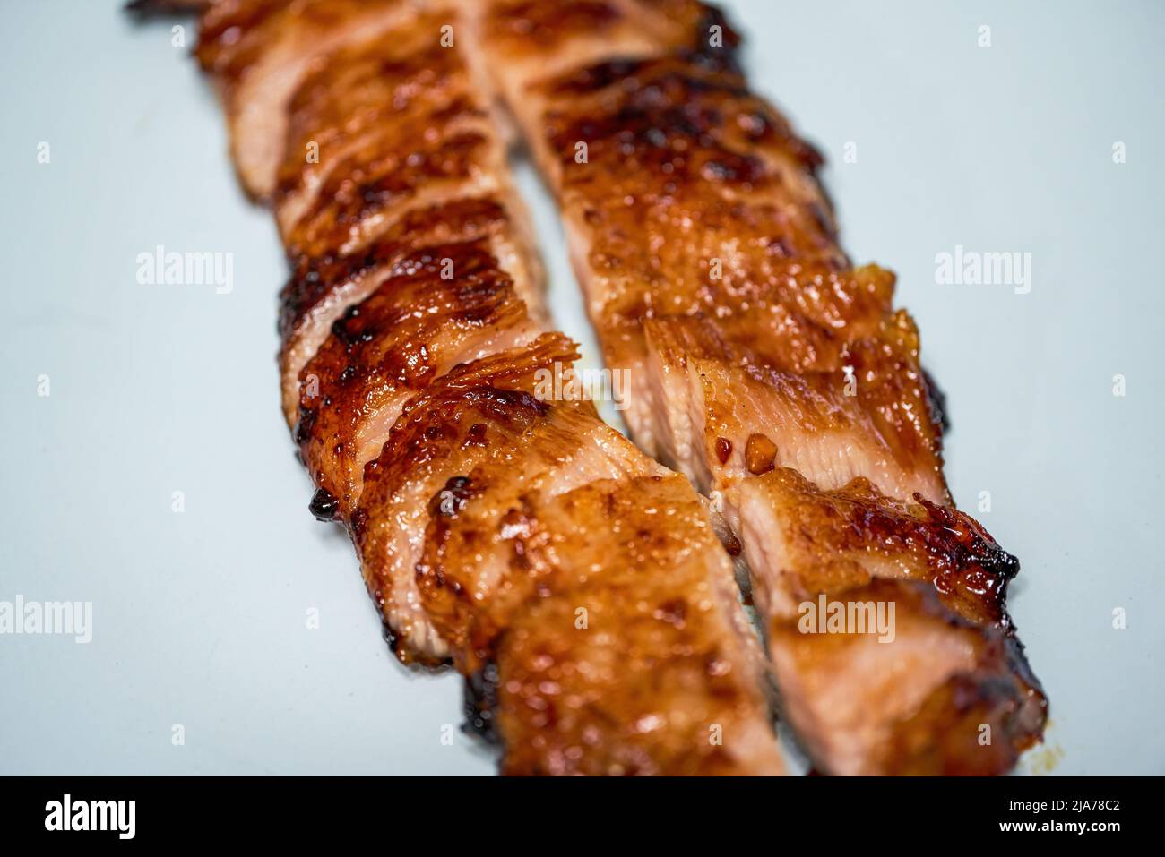 A delicious and tempting charcoal-grilled pork neck Stock Photo - Alamy