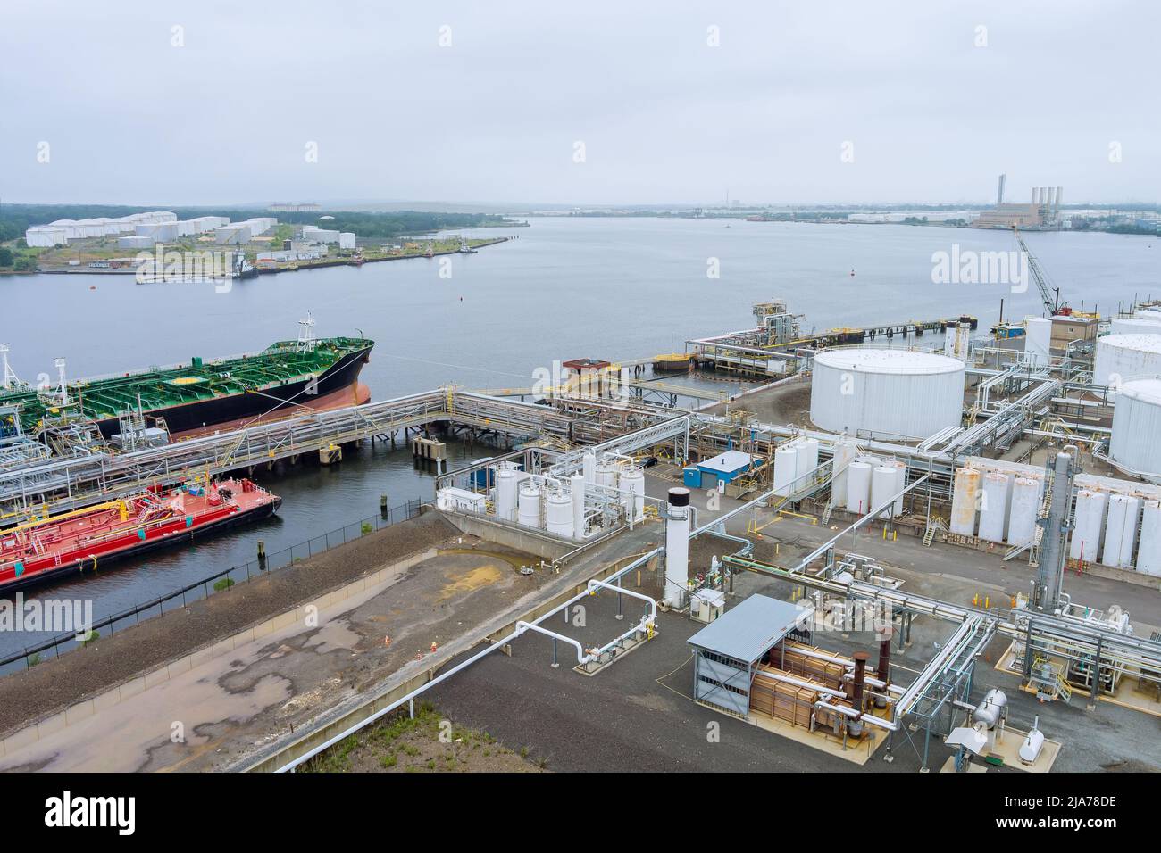 Aerial view transportation crude oil tanker oil storage tank terminal ...