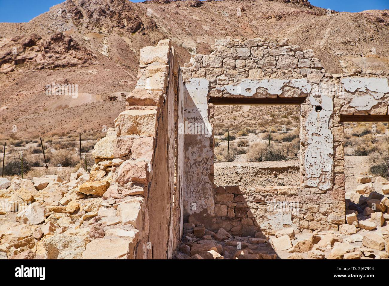 Desert abandoned stone building falling apart in ghost town Stock Photo ...