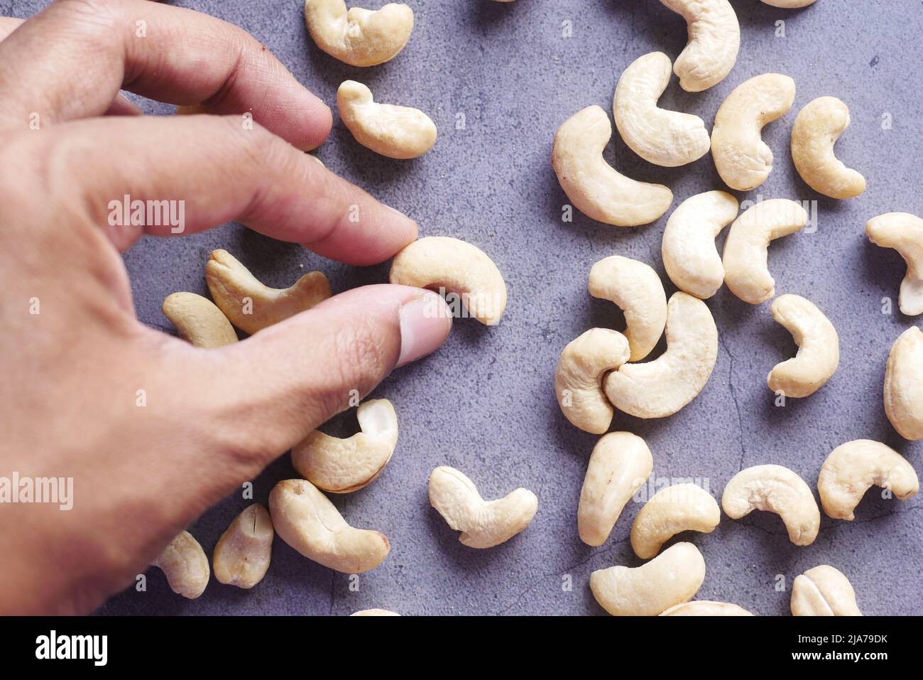 hand pick cashew nut on close up Stock Photo - Alamy