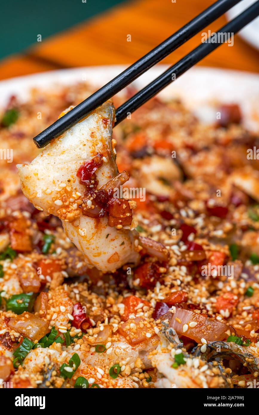 A spicy and delicious Sichuan dish, oily and spicy fish fillets Stock ...