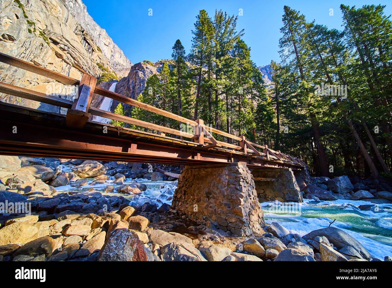 Bridge crossing over icy river in national park of Yosemite Stock Photo ...