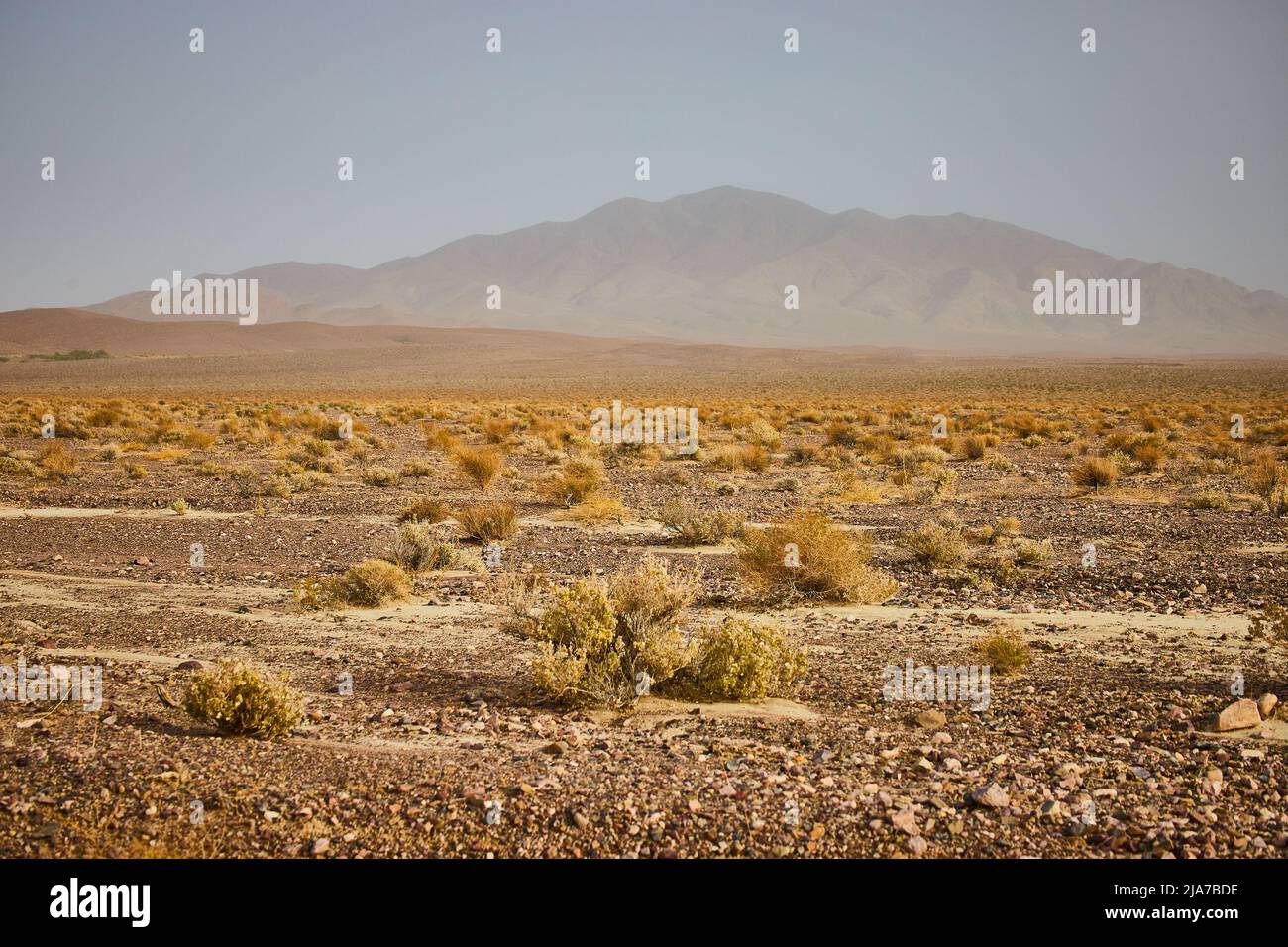 Desert landscape during sandstorm with sandy mountains in distance ...