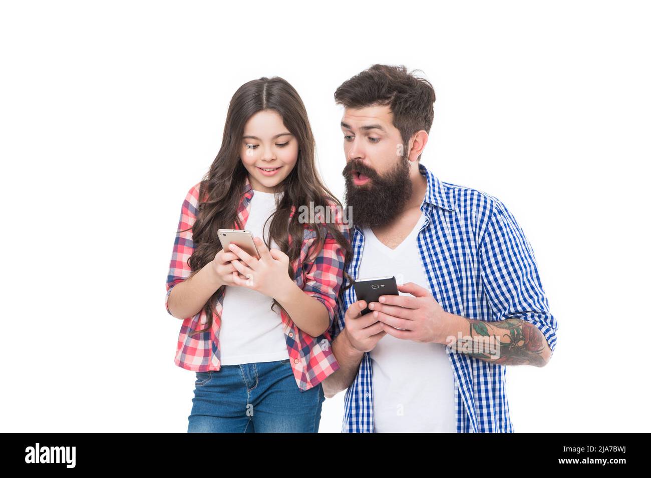 Social media addiction. Father and daughter use mobile phones. Family ...