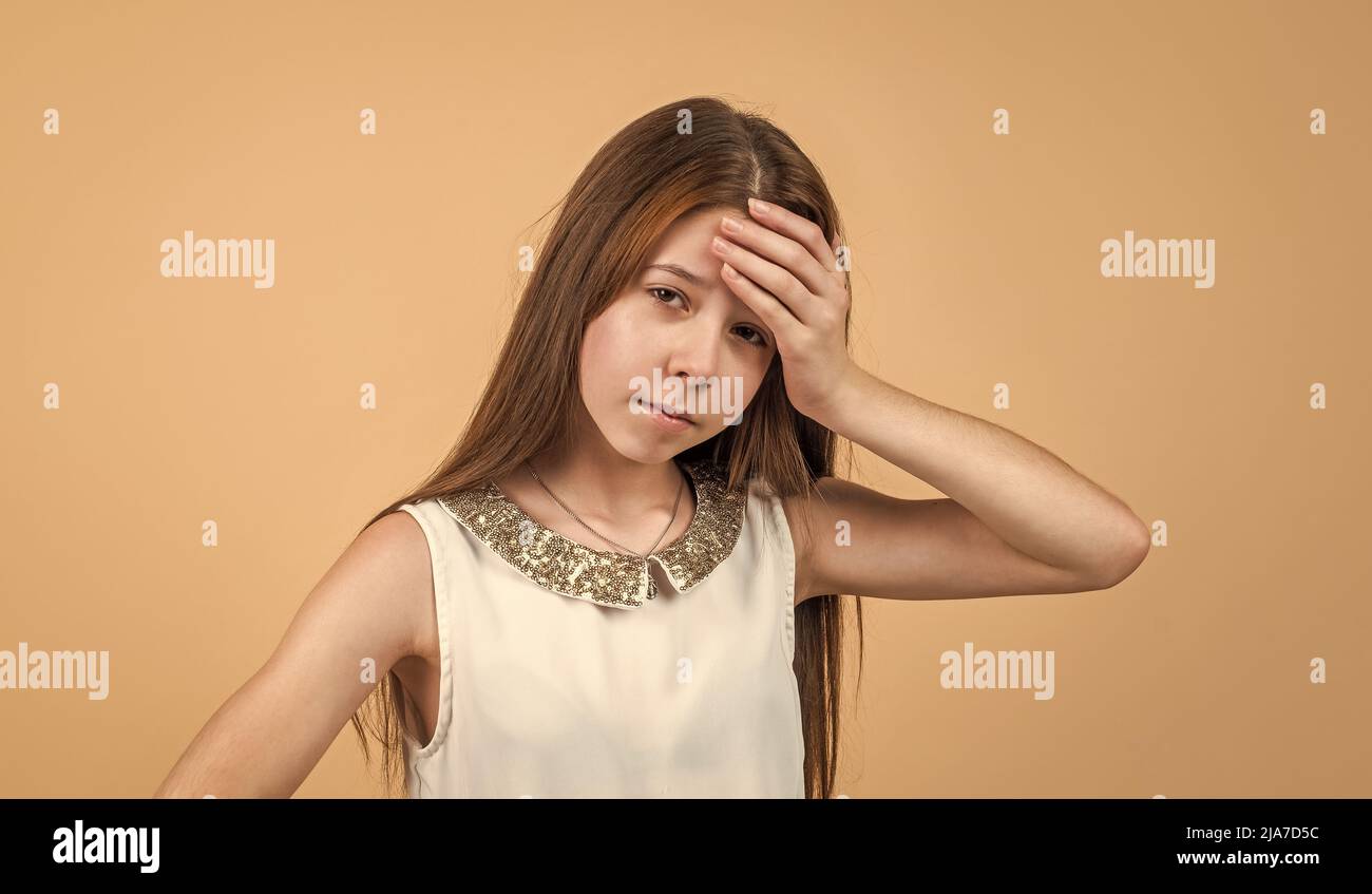 stressed girl kid touching forehead because of headache, migraine Stock ...