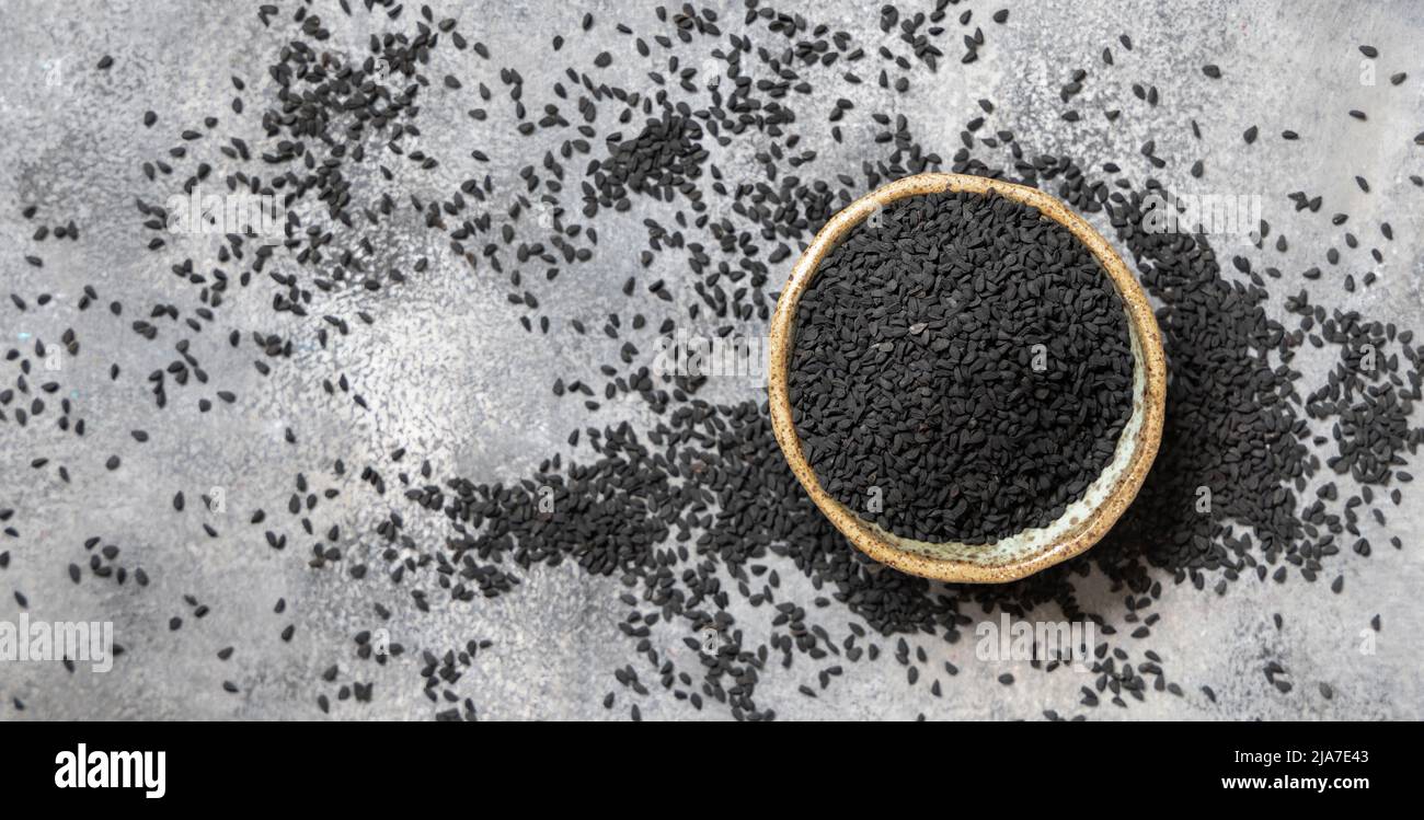 Indian spice Black cumin (nigella sativa or kalonji) seeds in bowl on ...