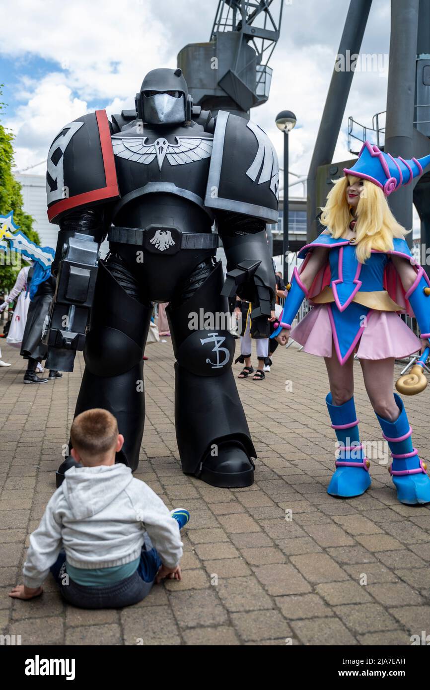 London, UK. 28 May 2022. A costumed visitor as a giant Warhammer ...