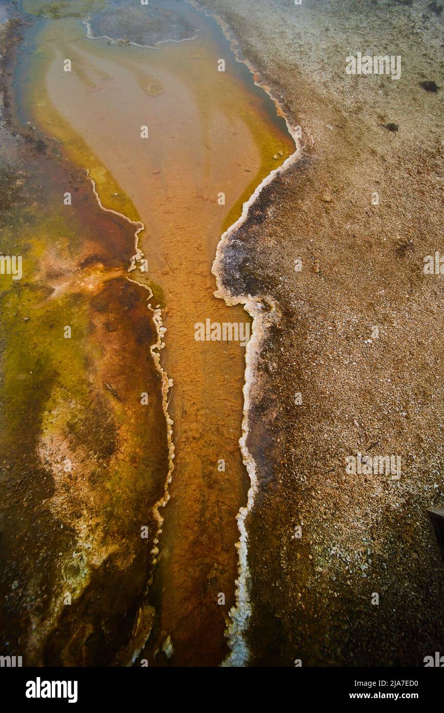 Colorful layers along small acidic creek in Yellowstone Stock Photo - Alamy