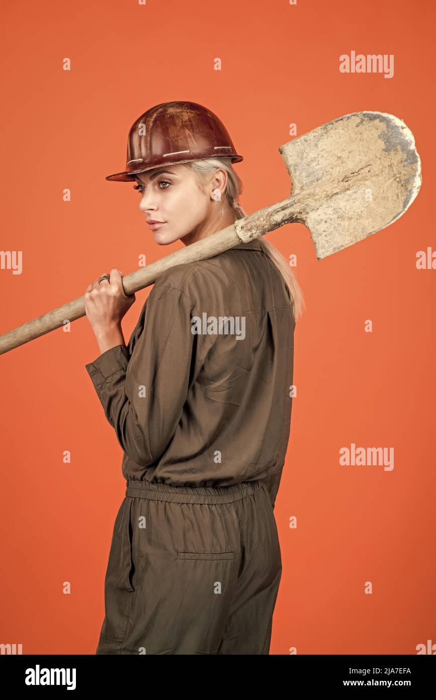 lets work. labor day. woman in boilersuit and helmet. female builder ...