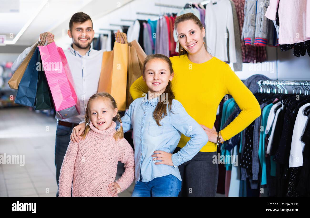 Portrait of happy young woman, two little girls and man with sho Stock ...