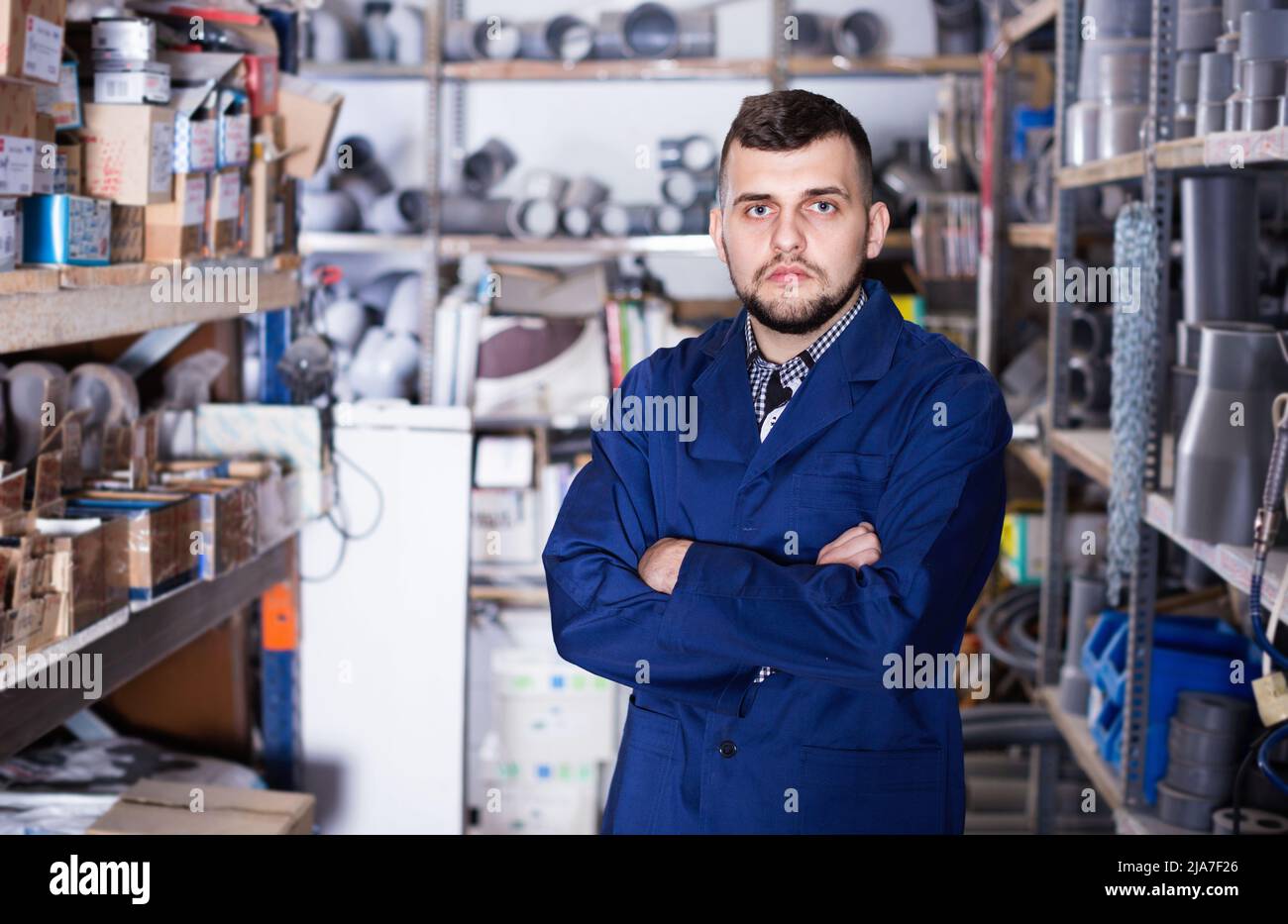 Working man demonstrating his workplace at workshop Stock Photo - Alamy