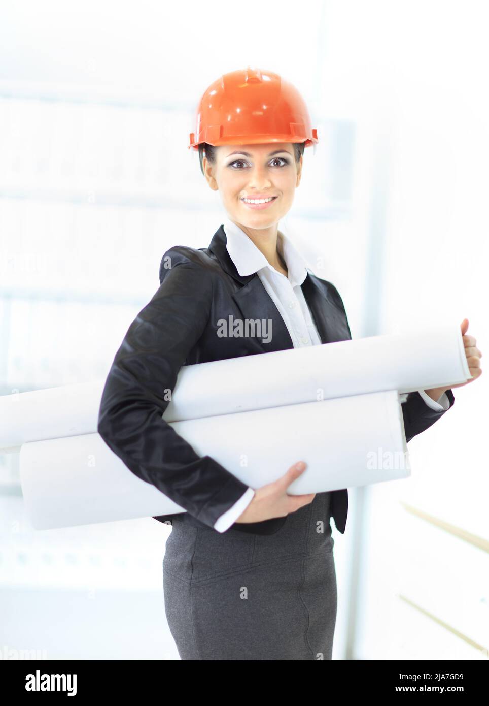 young female engineer with a roll of drawings Stock Photo - Alamy